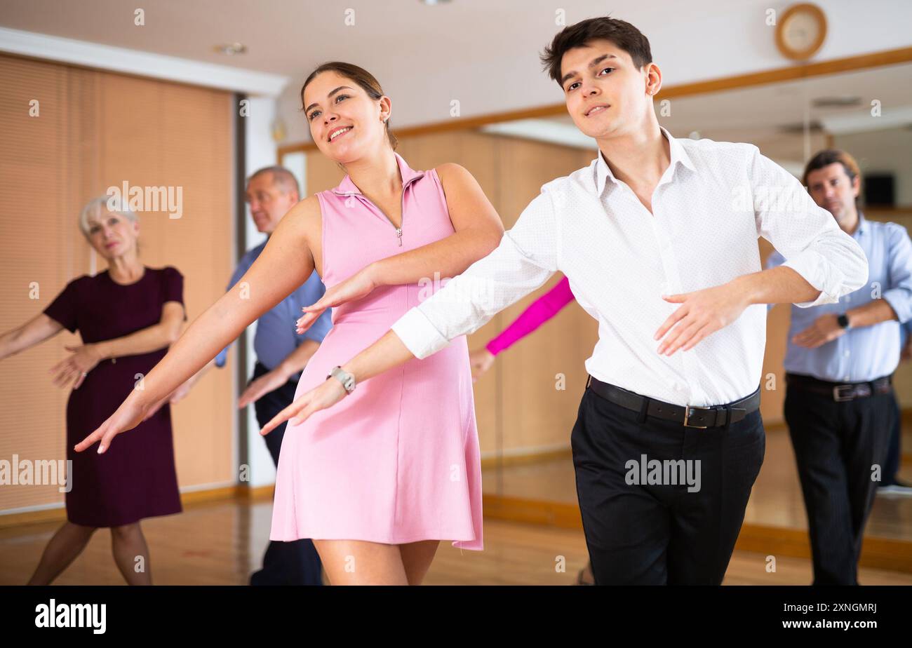 Young couple enjoying practicing jitterbug movements in studio Stock ...