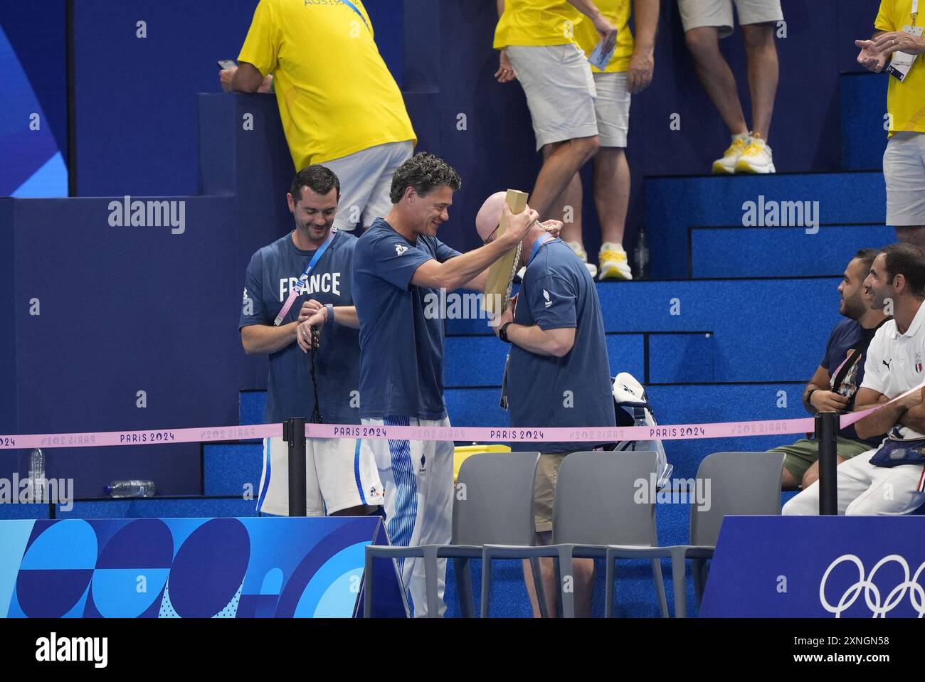 Paris, France. 31st July, 2024. French Coach of Leon Marchand, Nicolas ...