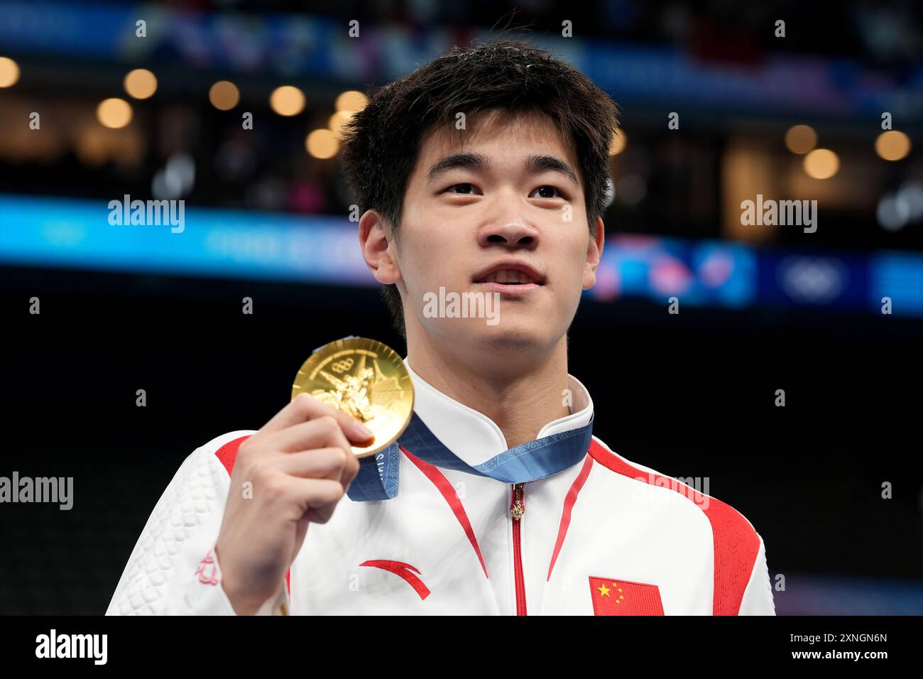 China's Zhanle Pan poses with his gold medal after winning the men's ...
