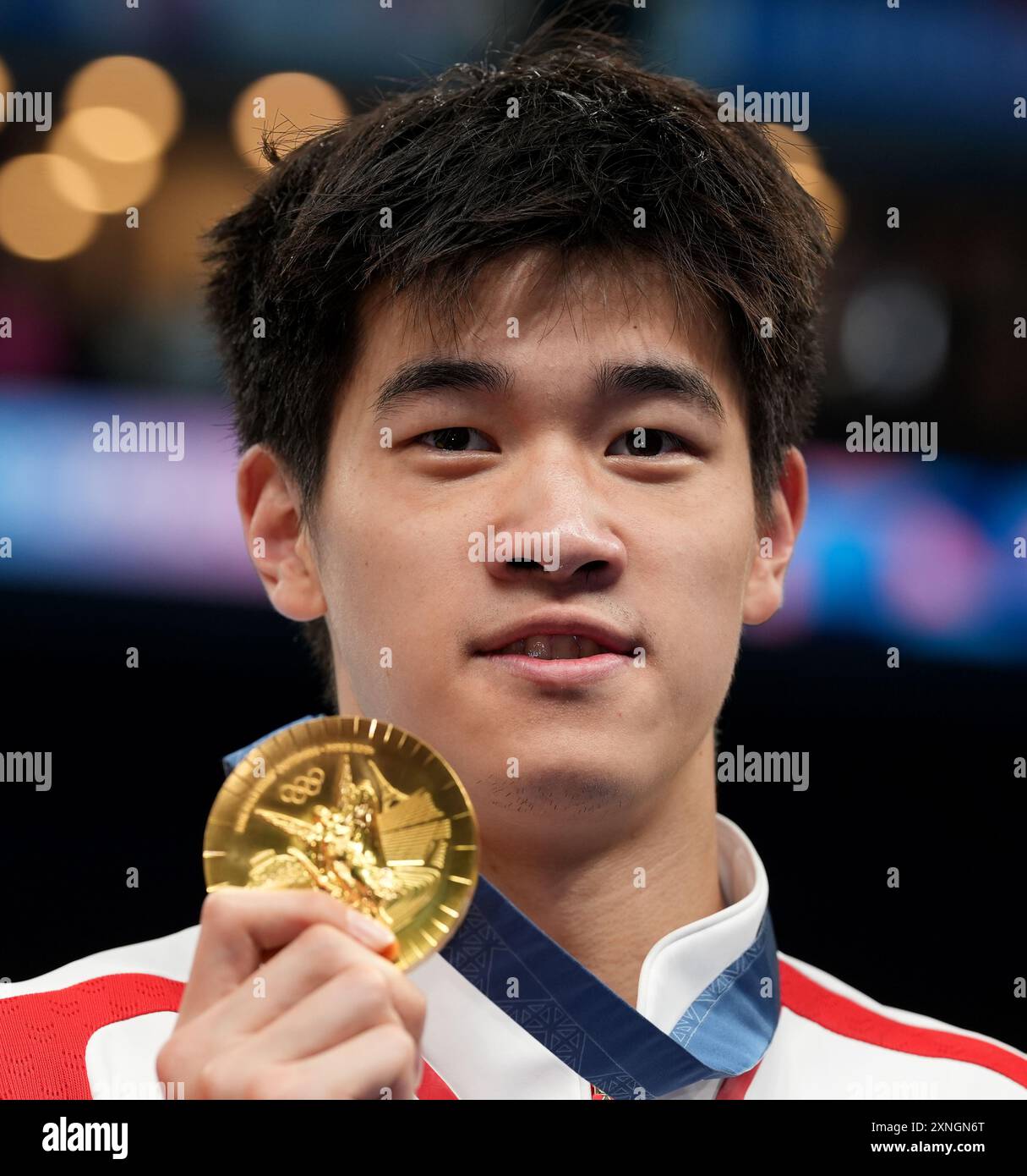 China's Zhanle Pan poses with his gold medal after winning the men's ...
