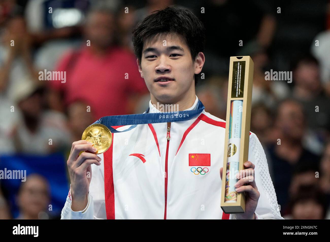 Pan Zhanle, of China, poses with his gold medal after winning the men's ...