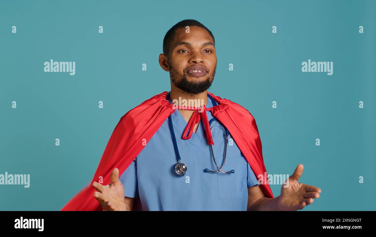 Male nurse portraying superhero showing courage and strength fighting ...
