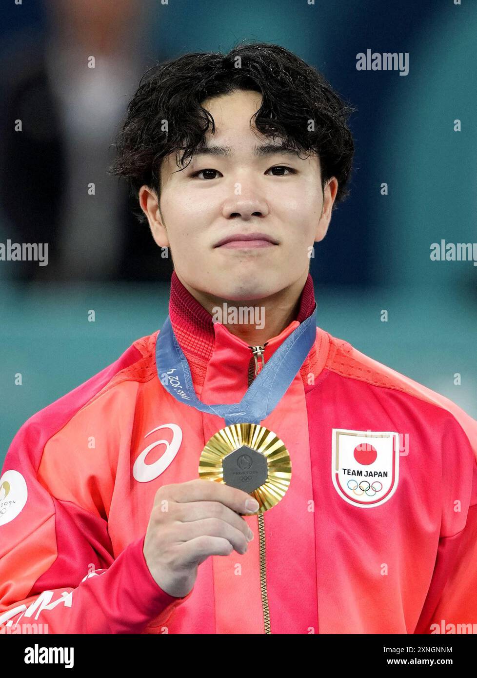 Shinnosuke Oka of Japan poses with his gold medal after winning the men ...