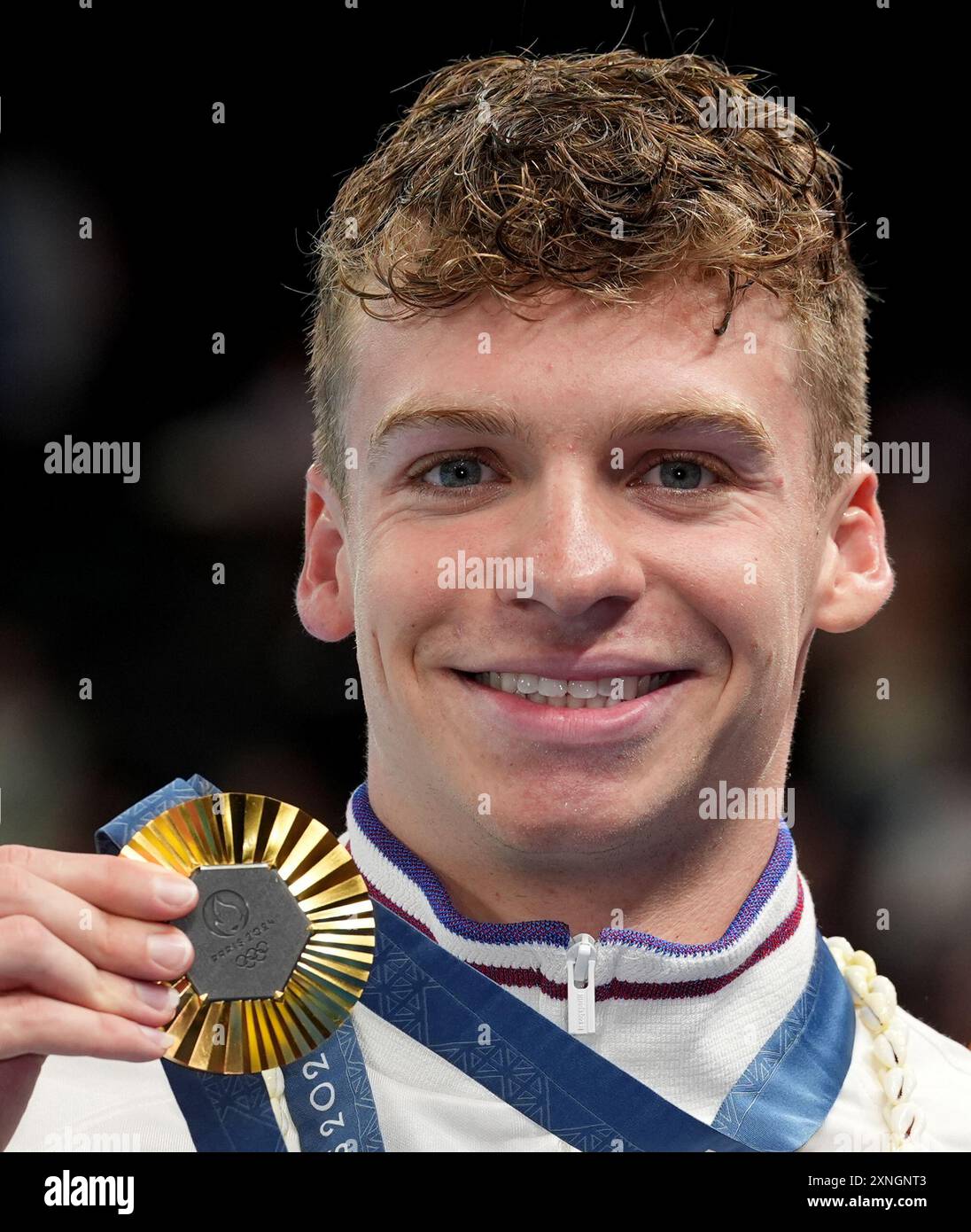 France's Leon Marchand poses with his gold medal after winning the men ...
