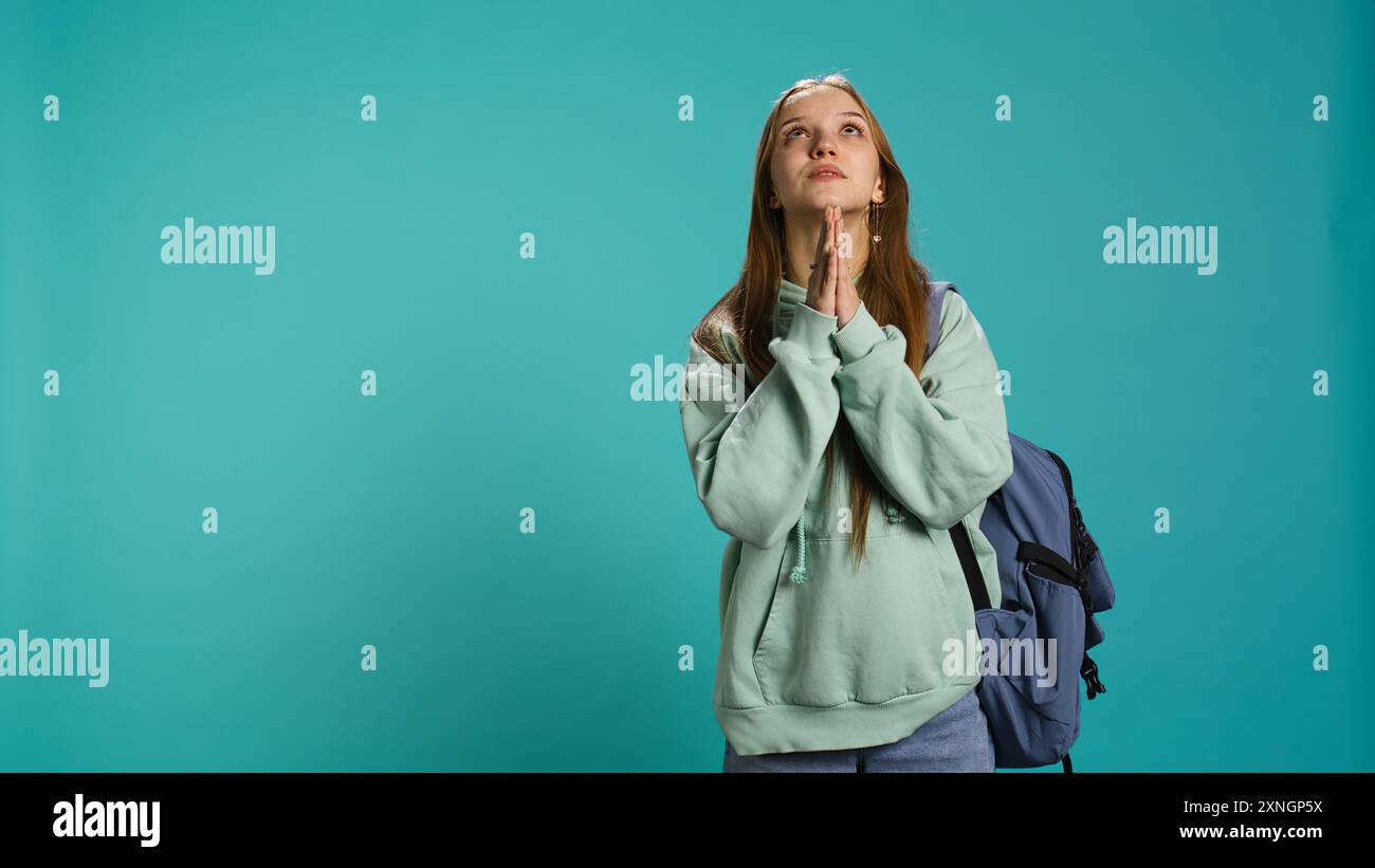 Hopeless young girl praying to deity for salvation. Religious teenager ...