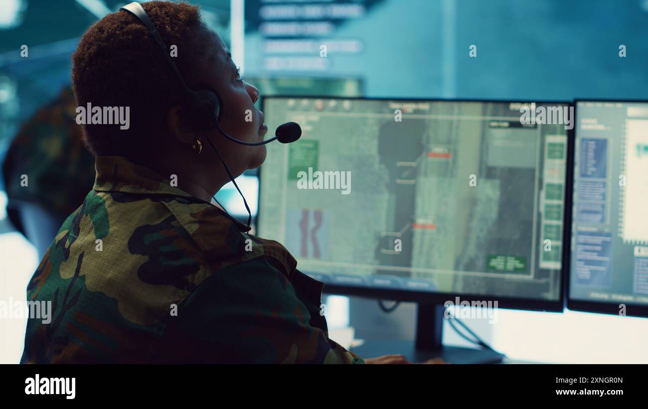 Female army operator registers important information from military ...