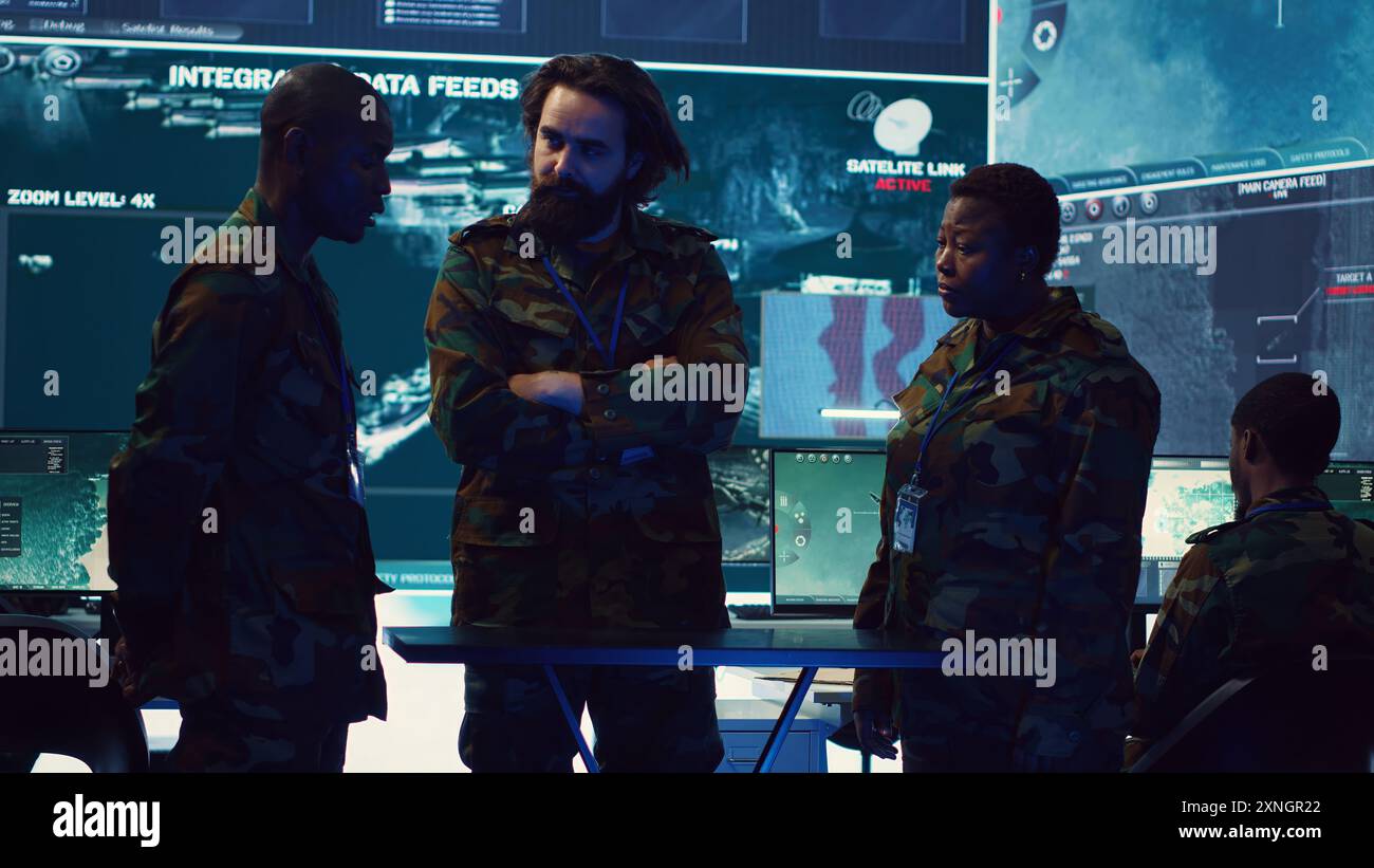 Brigadier general and his staff studying radar data on a holographic ...