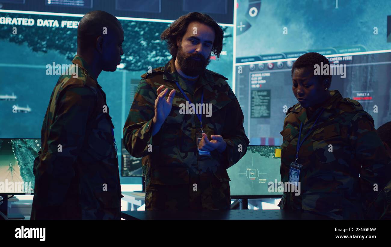 Army officers review data on a hologram to create a brief for the new ...