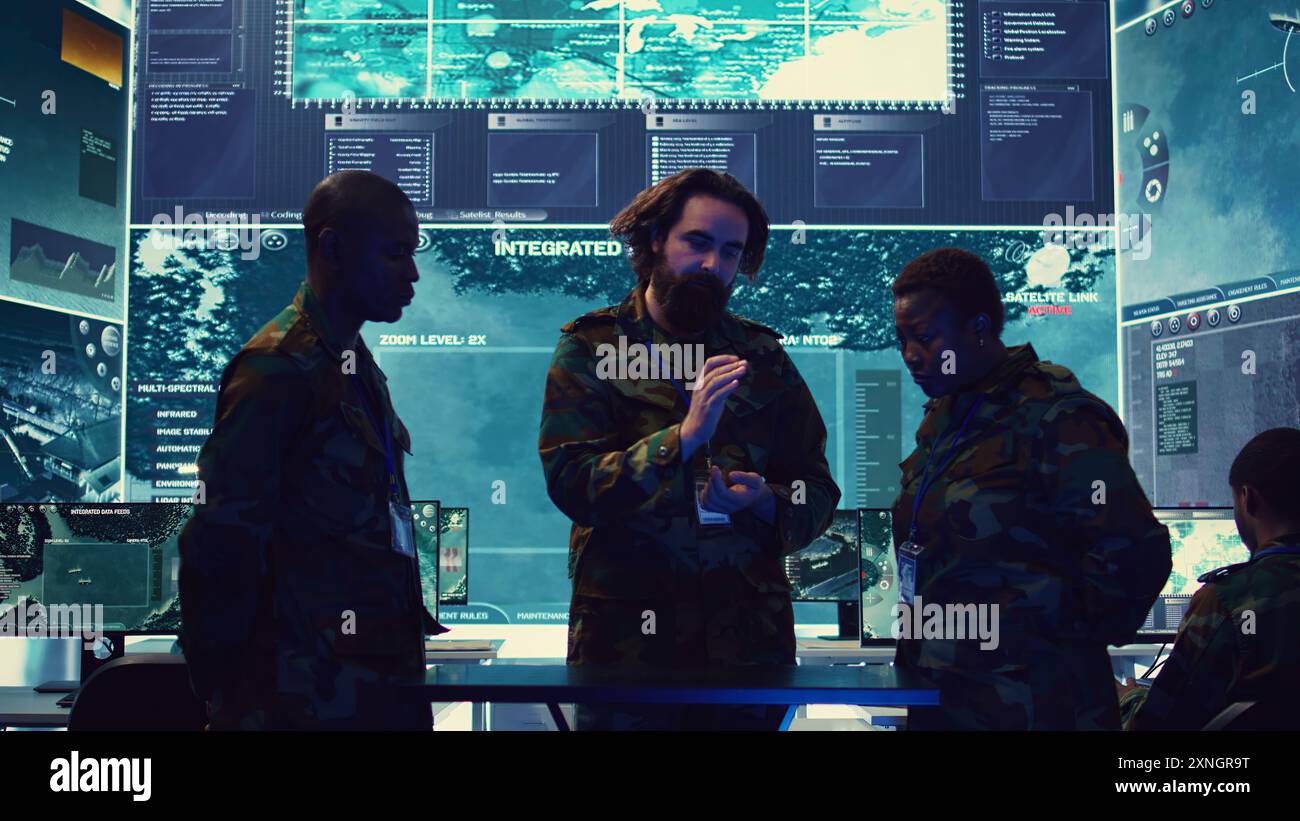 Army officers review data on a hologram to create a brief for the new ...