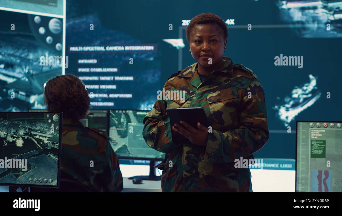 Woman sergeant major working on deployment of electronic warfare tools ...