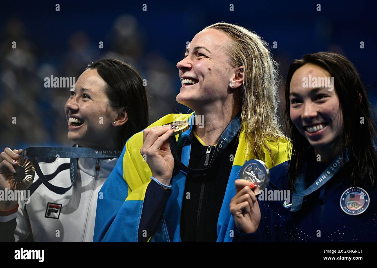 Paris, France. 31st July, 2024. Gold medalist Sarah Sjoestroem (C) of ...