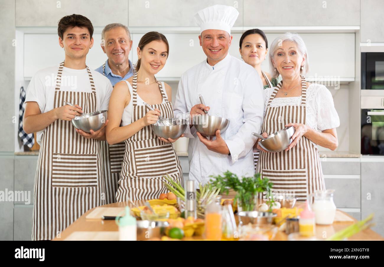 Group portrait of a chef and his students in kitchen Stock Photo - Alamy
