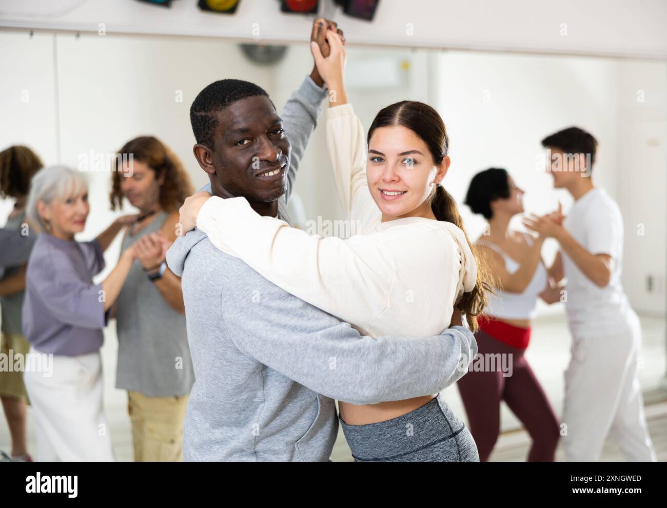 Cheerful people rehearsing dance routine hi-res stock photography and ...