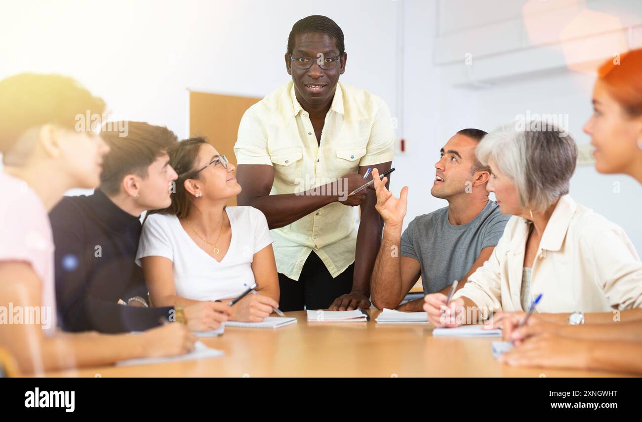 Group of people attending language course Stock Photo - Alamy