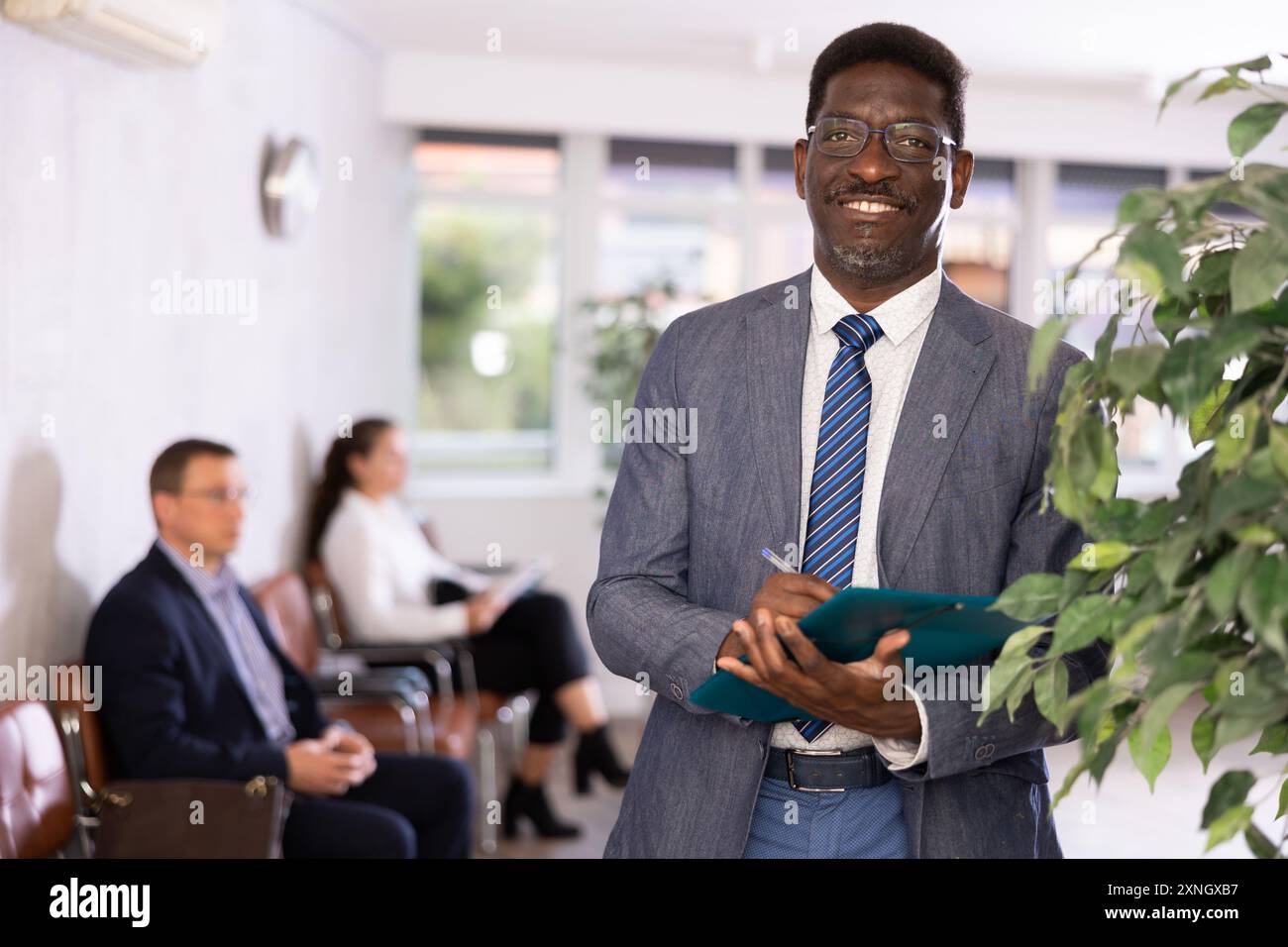 Adult smiling man stands hi-res stock photography and images - Alamy