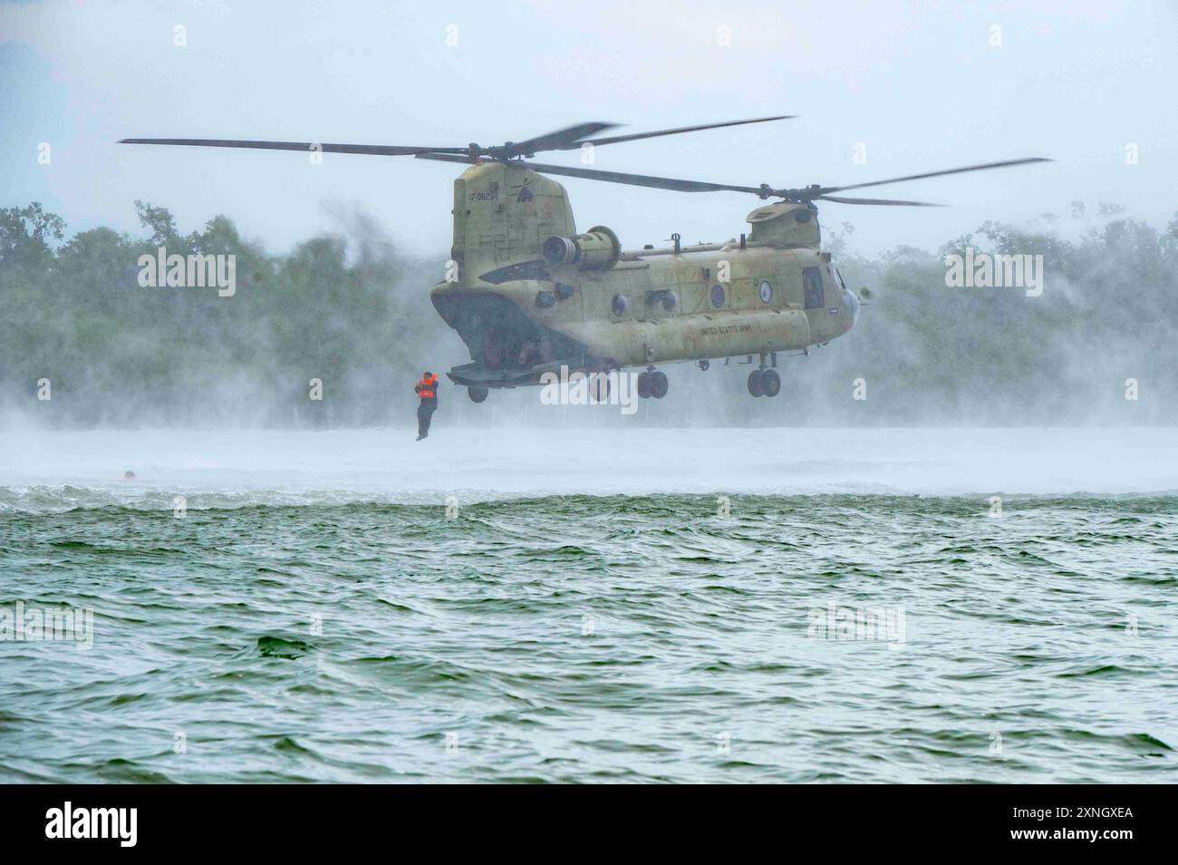 Belize Coast Guard member performs a helocast jump off the 1st ...