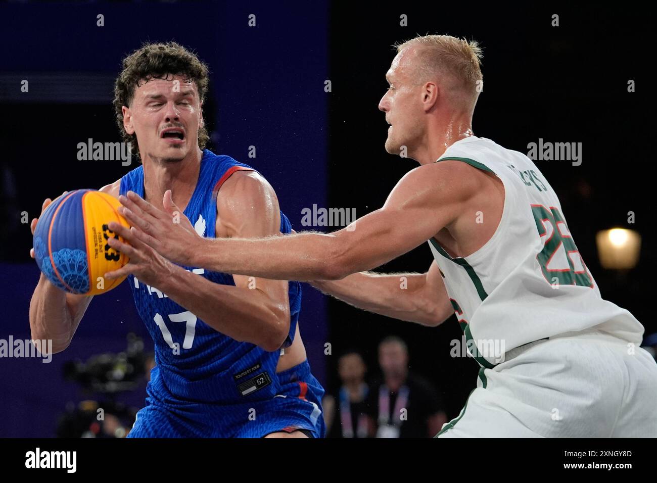 France's Jules Rambaut comes under pressure from Lithuania's Evaldes ...