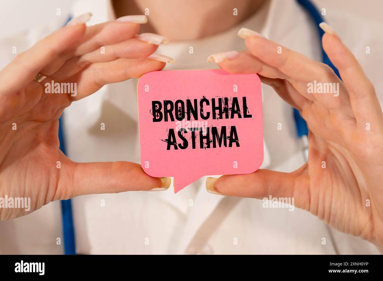 Asthma. doctor holding a card with the text bronchial asthma Stock ...