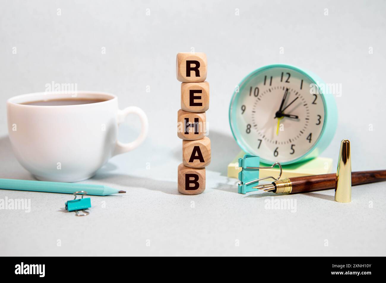 RECOVERY word concept written on wooden cubes lying on a light table ...