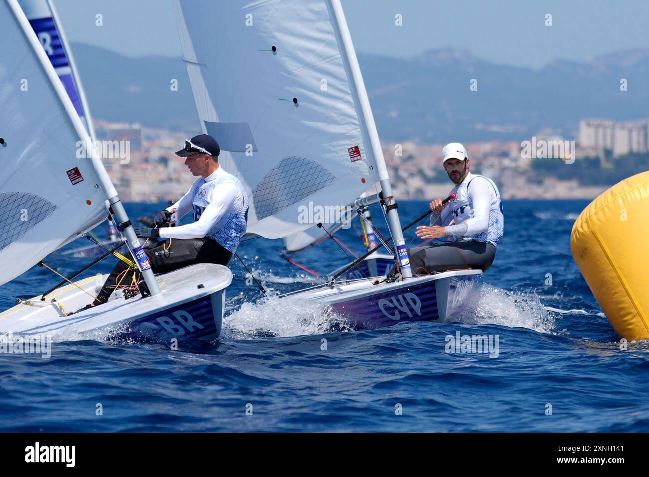 Michael Beckett of Britain and Pavlos Kontides of Cyprus round a mark ...