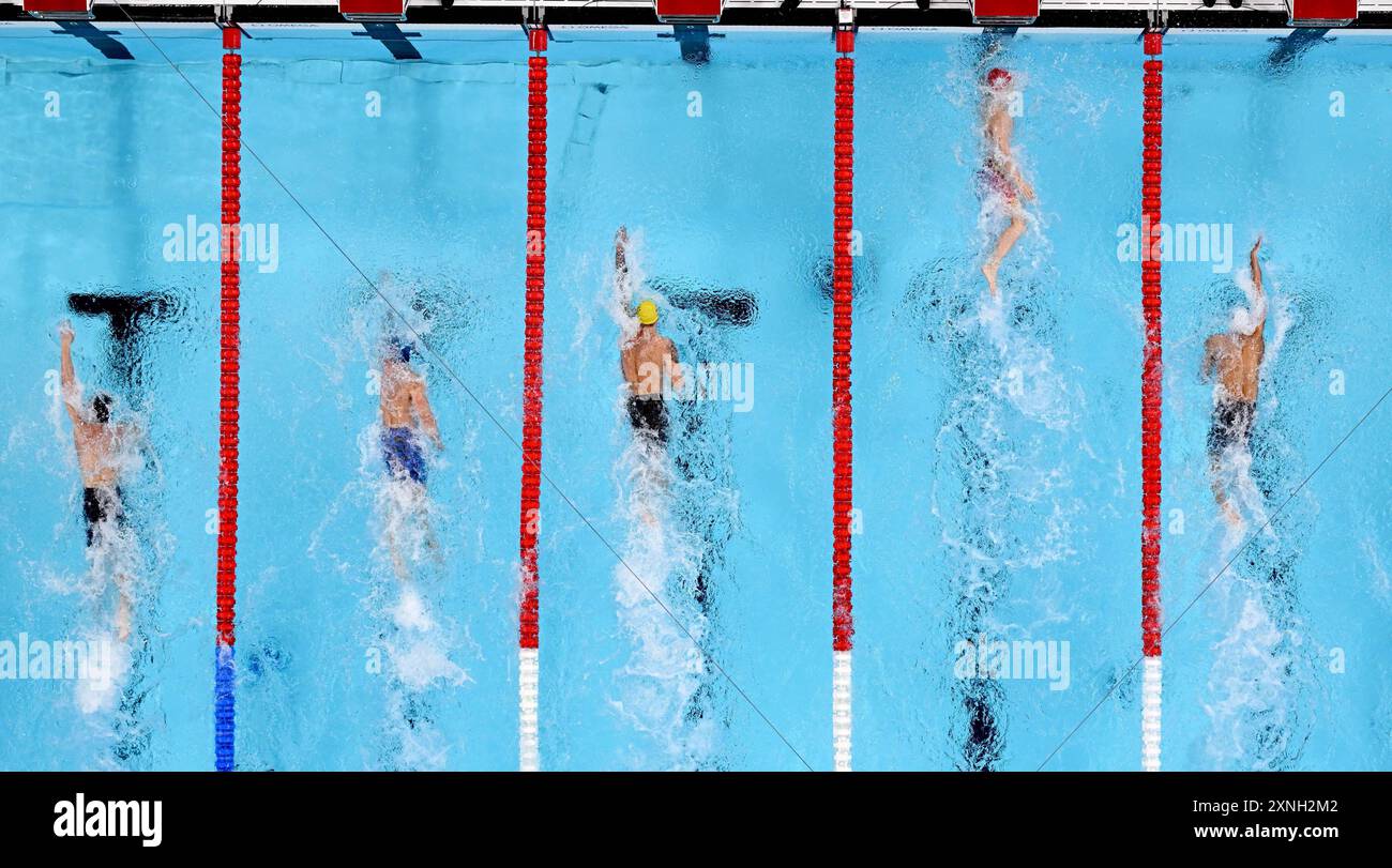 Paris, France. 31st July, 2024. Pan Zhanle (2nd R) of China touches the finish line during the ...
