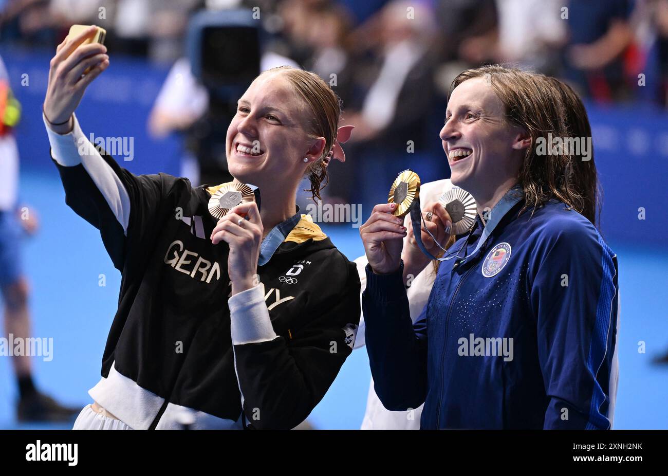 Paris, France. 31st July, 2024. Gold medalist Katie Ledecky (R) of the ...
