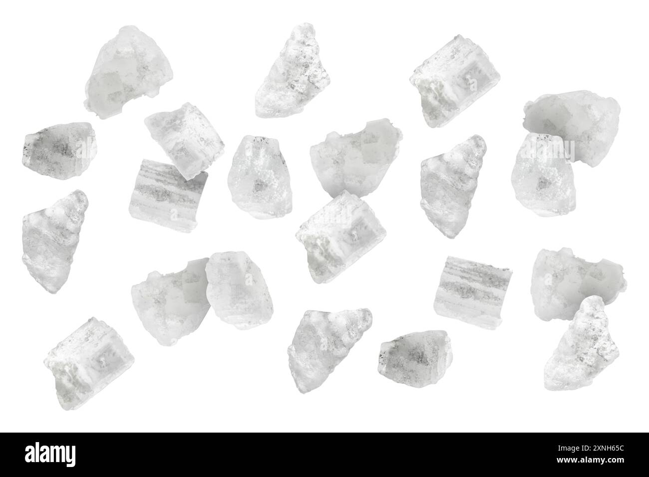 Sea salt crystals in air on white background Stock Photo - Alamy