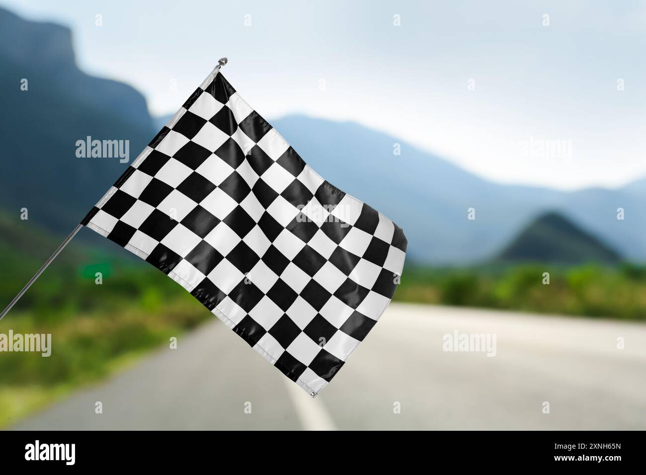 Checkered finish flag and asphalt racing track outdoors Stock Photo - Alamy