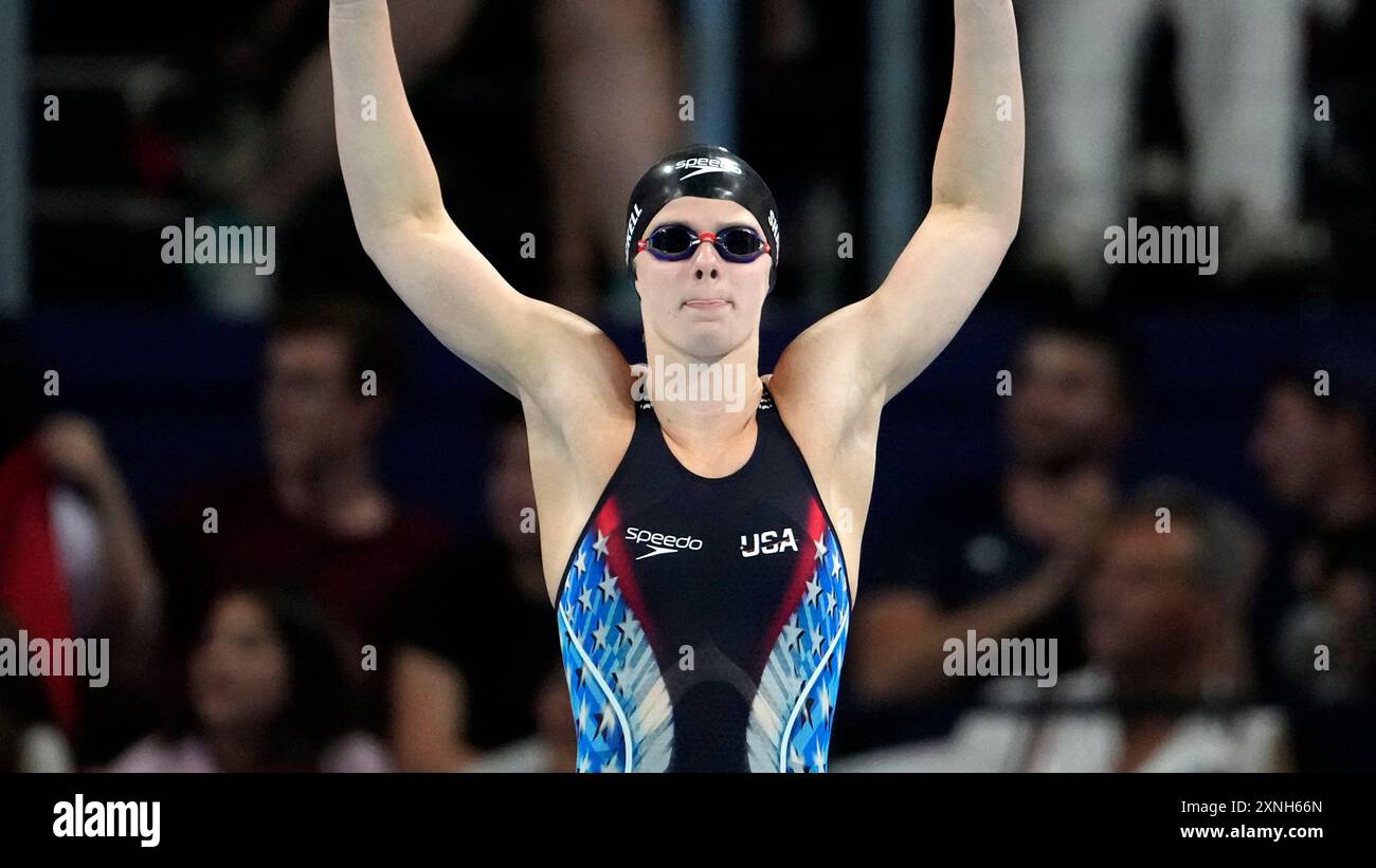 Alex Shackell, of the United States, stretches ahead of her women's 200 ...