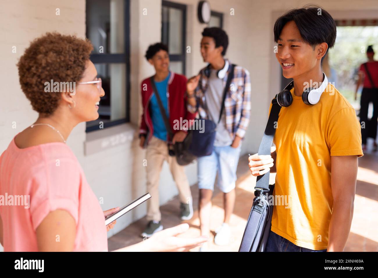 Teacher student talking hallway hi-res stock photography and images - Alamy