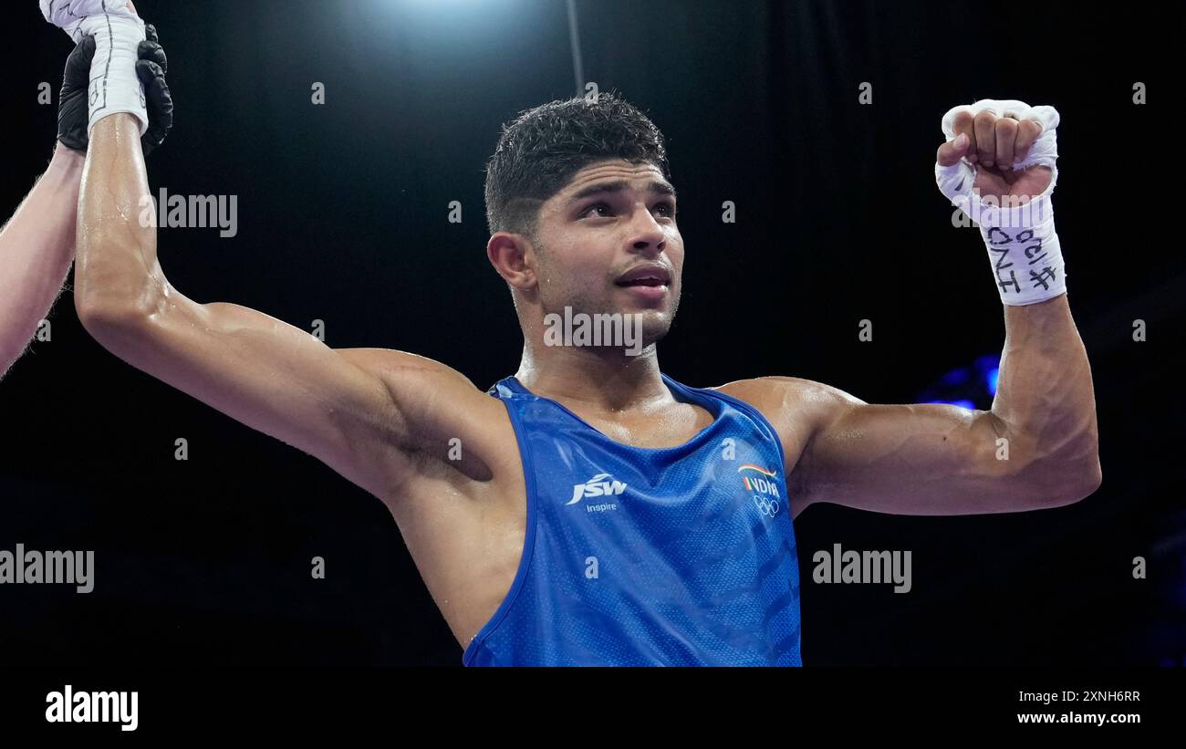 India's Nishant Dev celebrates after defeating Ecuador's Jose Rodriguez ...