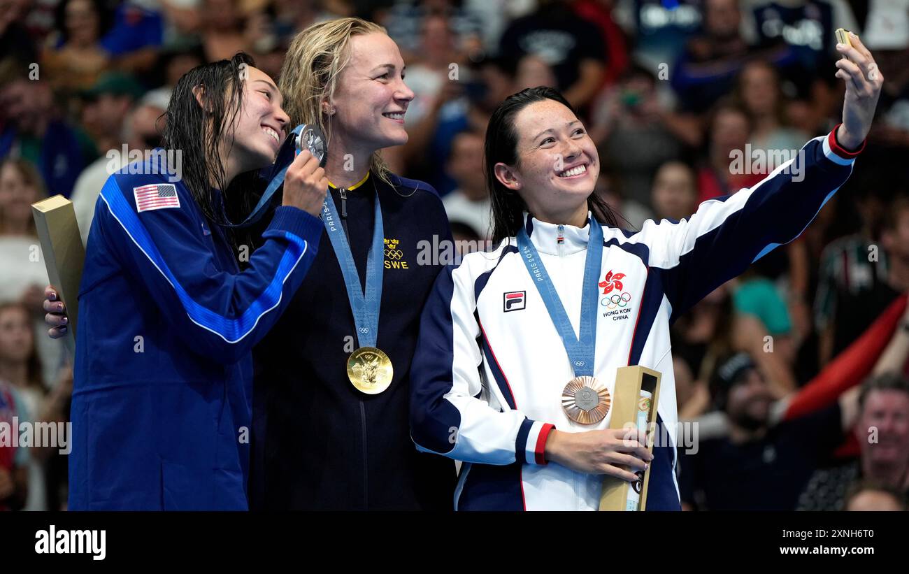 Gold medalist Sarah Sjoestroem, center, of Sweden, poses with silver ...