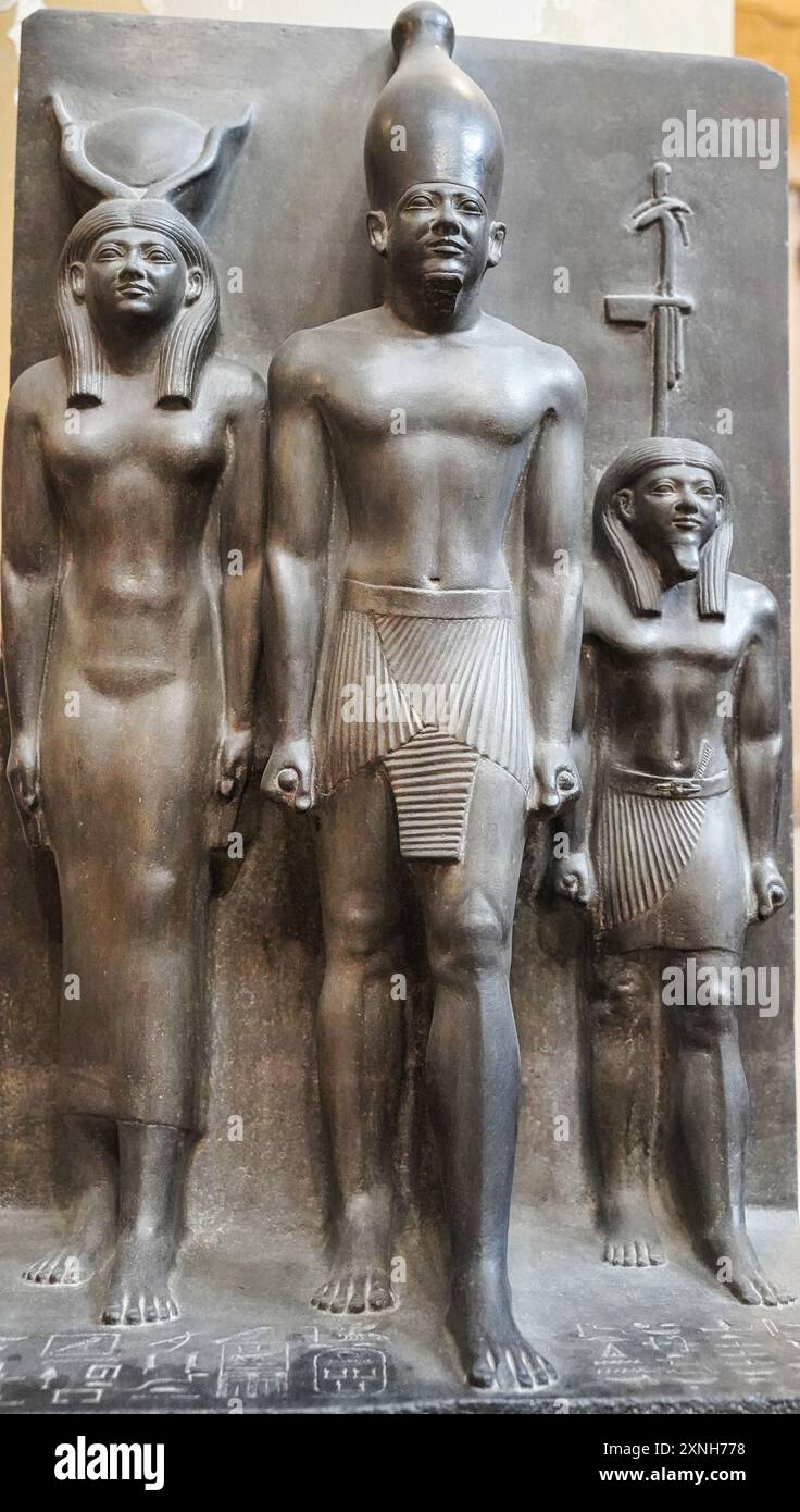 Pharoah Menkaure is flanked by the Goddess Hathor on left and the nome ...