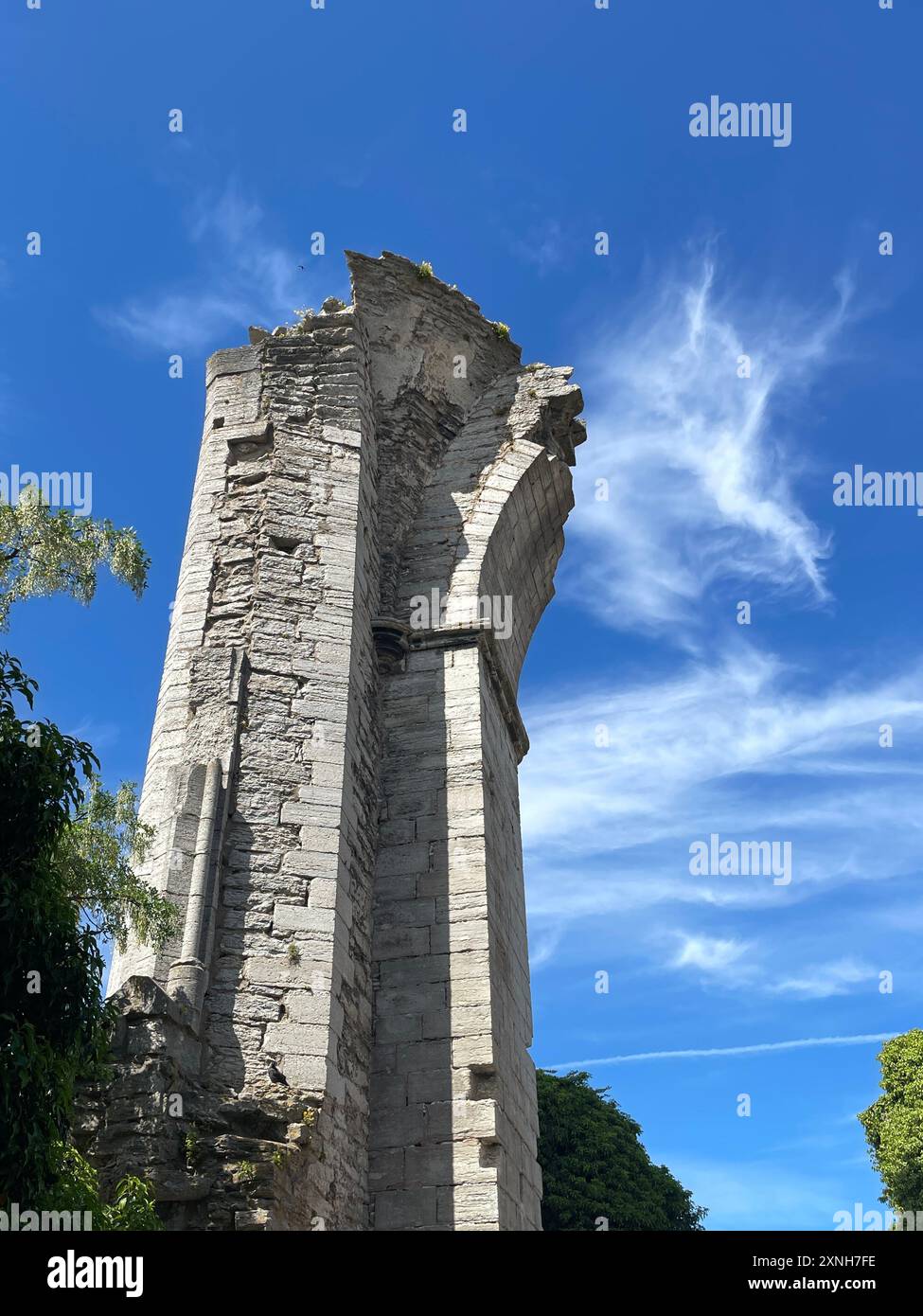 Historic stone ruins set against a bright blue sky. Perfect for history ...