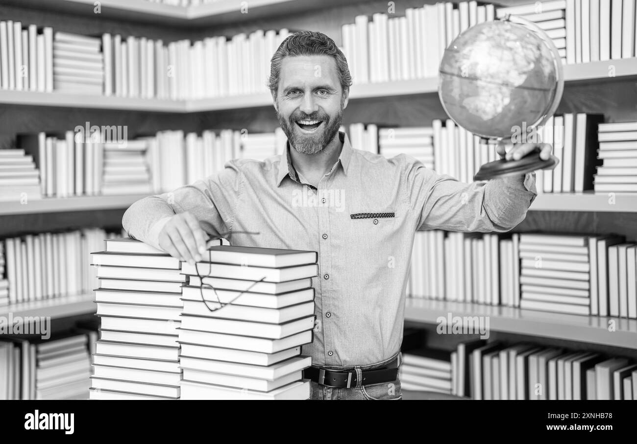 university teacher professor in school classroom library preparing for ...