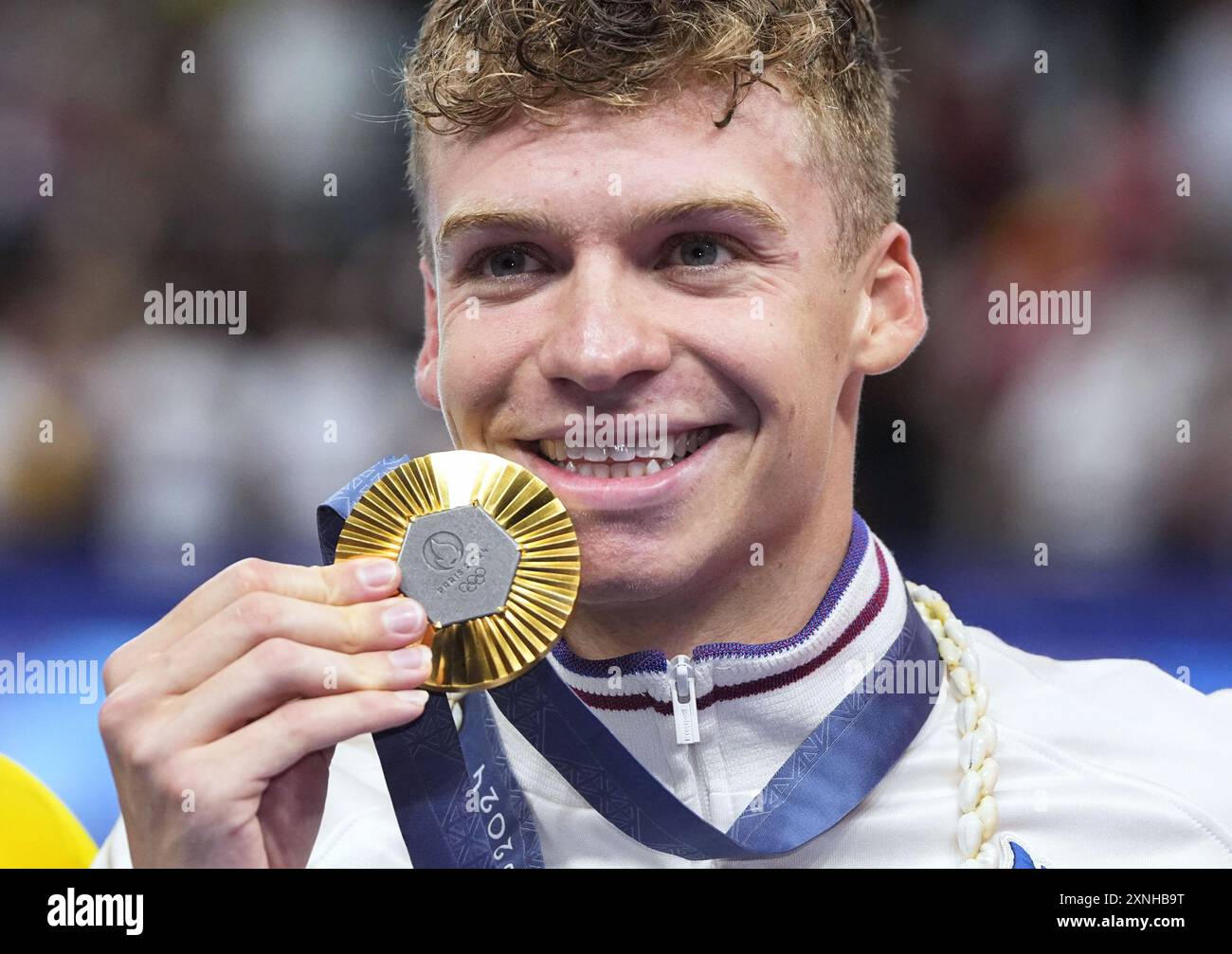 Leon Marchand of France poses with his gold medal after winning the men ...