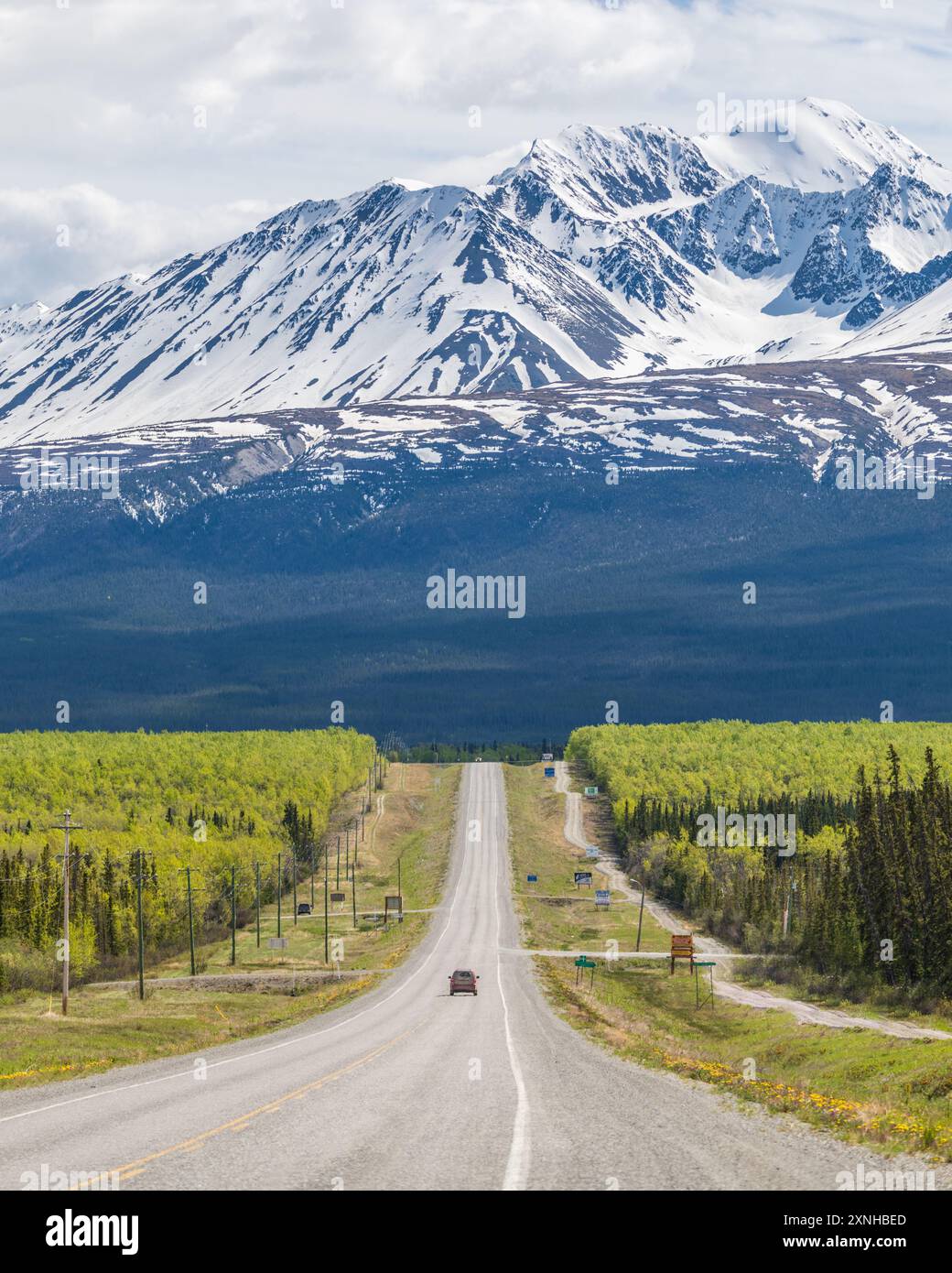 Alaska Highway driving into Haines Junction town in spring time with ...