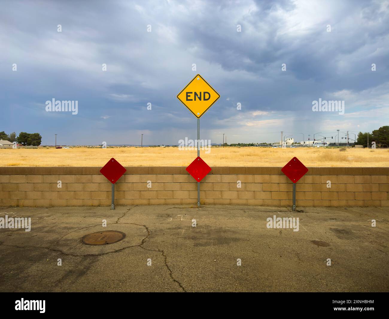 The End caution sign in front of stormy landscape background Stock ...