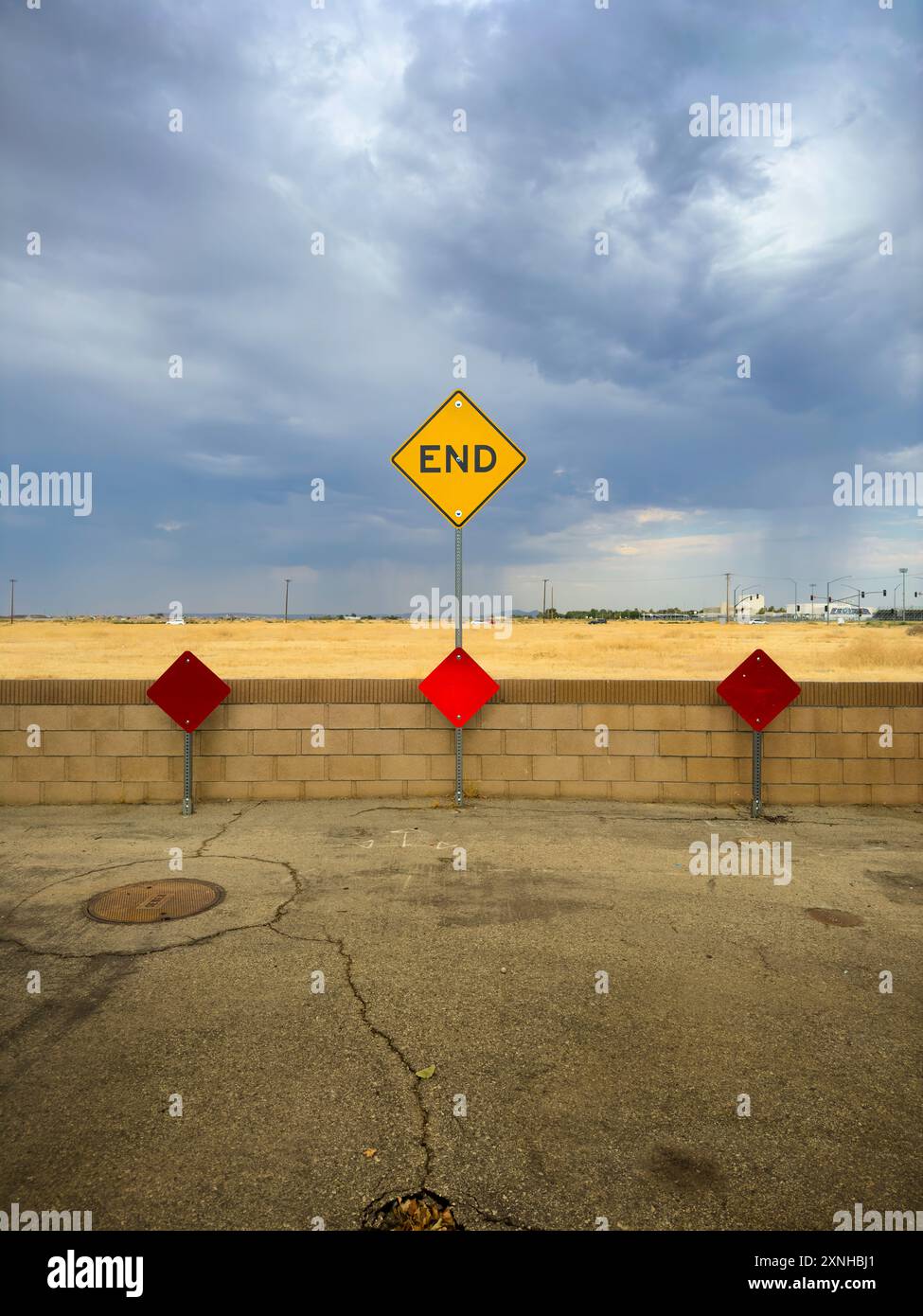 The End caution sign in front of stormy landscape background Stock ...