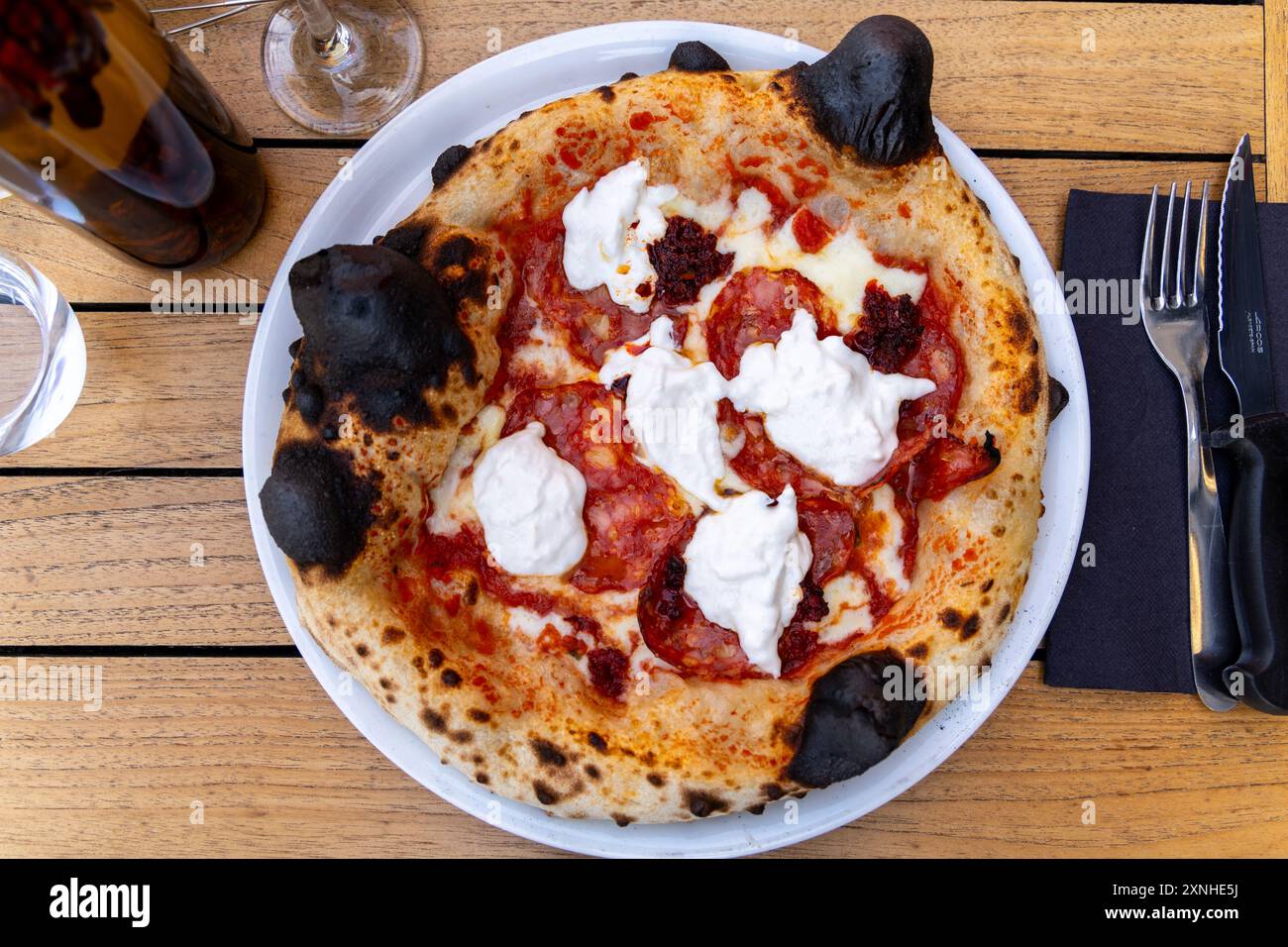 wood fired pizza black burned crust top down Stock Photo - Alamy