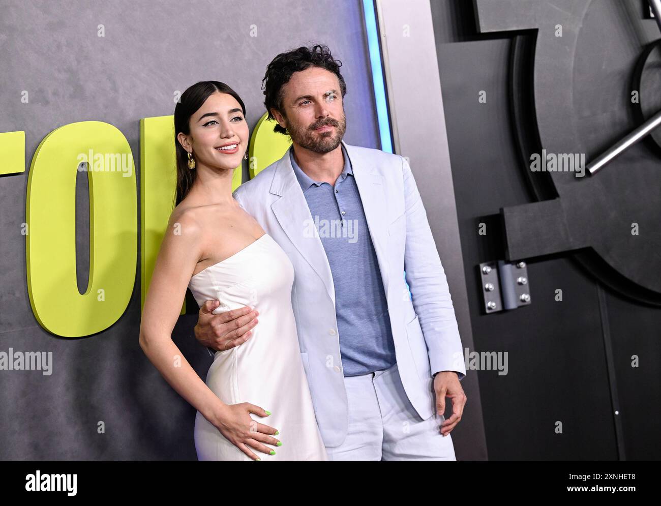 Caylee Cowan, left, and Casey Affleck attend the Apple Original Films premiere of "The ...
