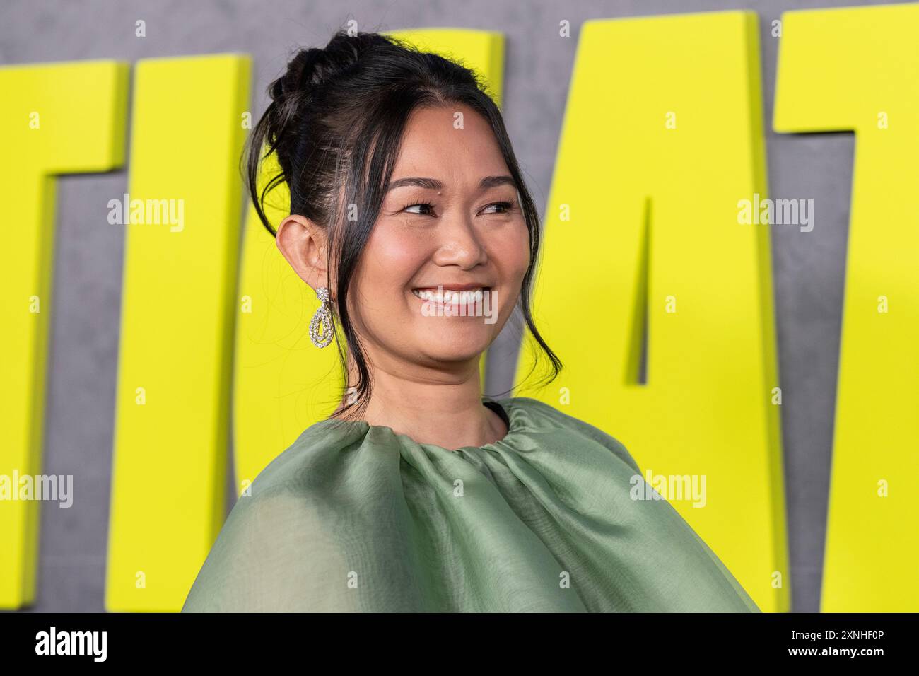 Hong Chau wearing dress by Prada and jewelry by Chopard attends Apple ...