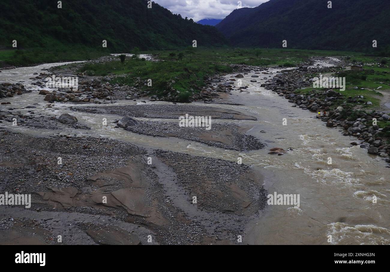 mountain river balason, flowing through the lush green valley of terai ...
