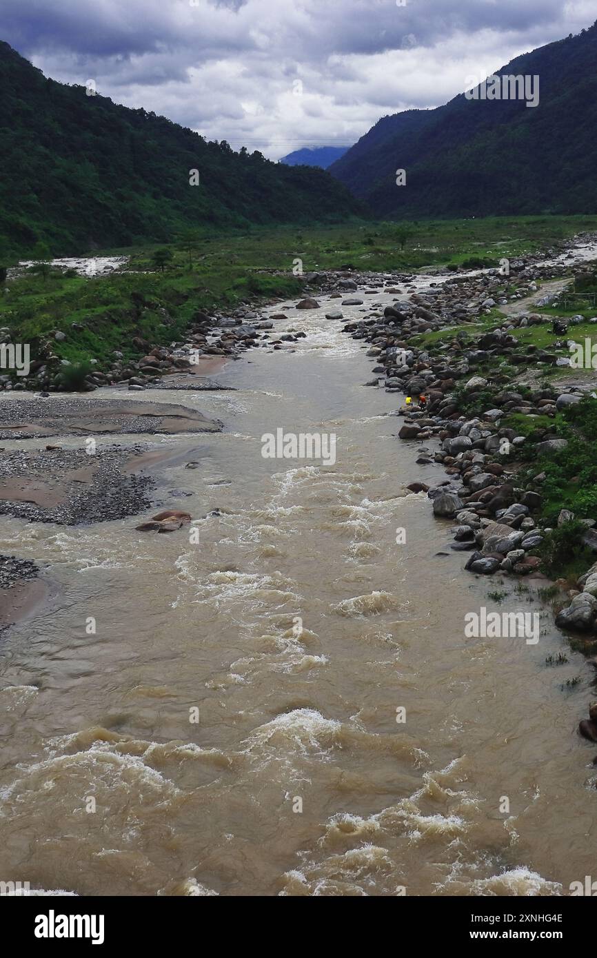 mountain river balason, flowing through the lush green valley of terai ...