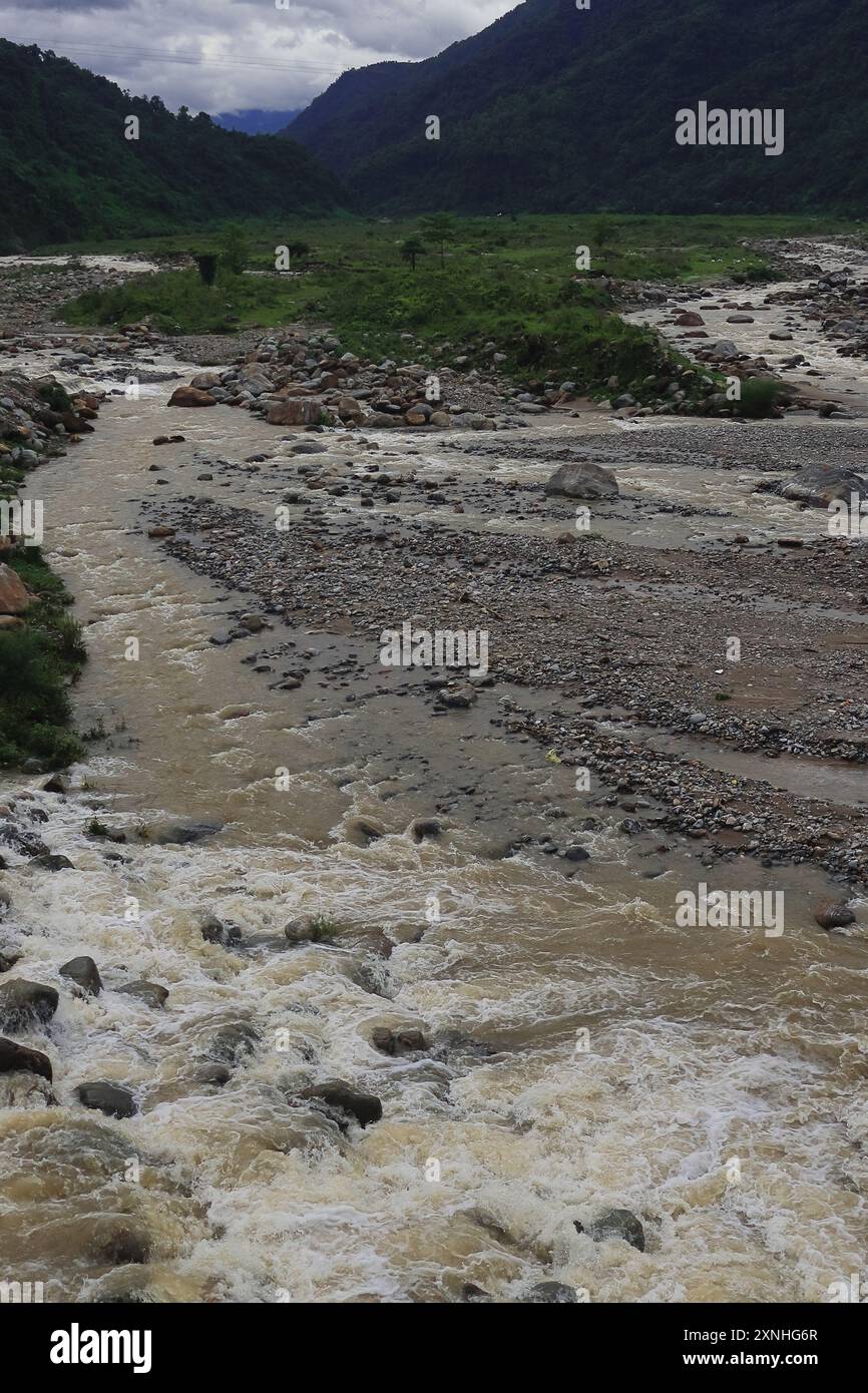mountain river balason, flowing through the lush green valley of terai ...