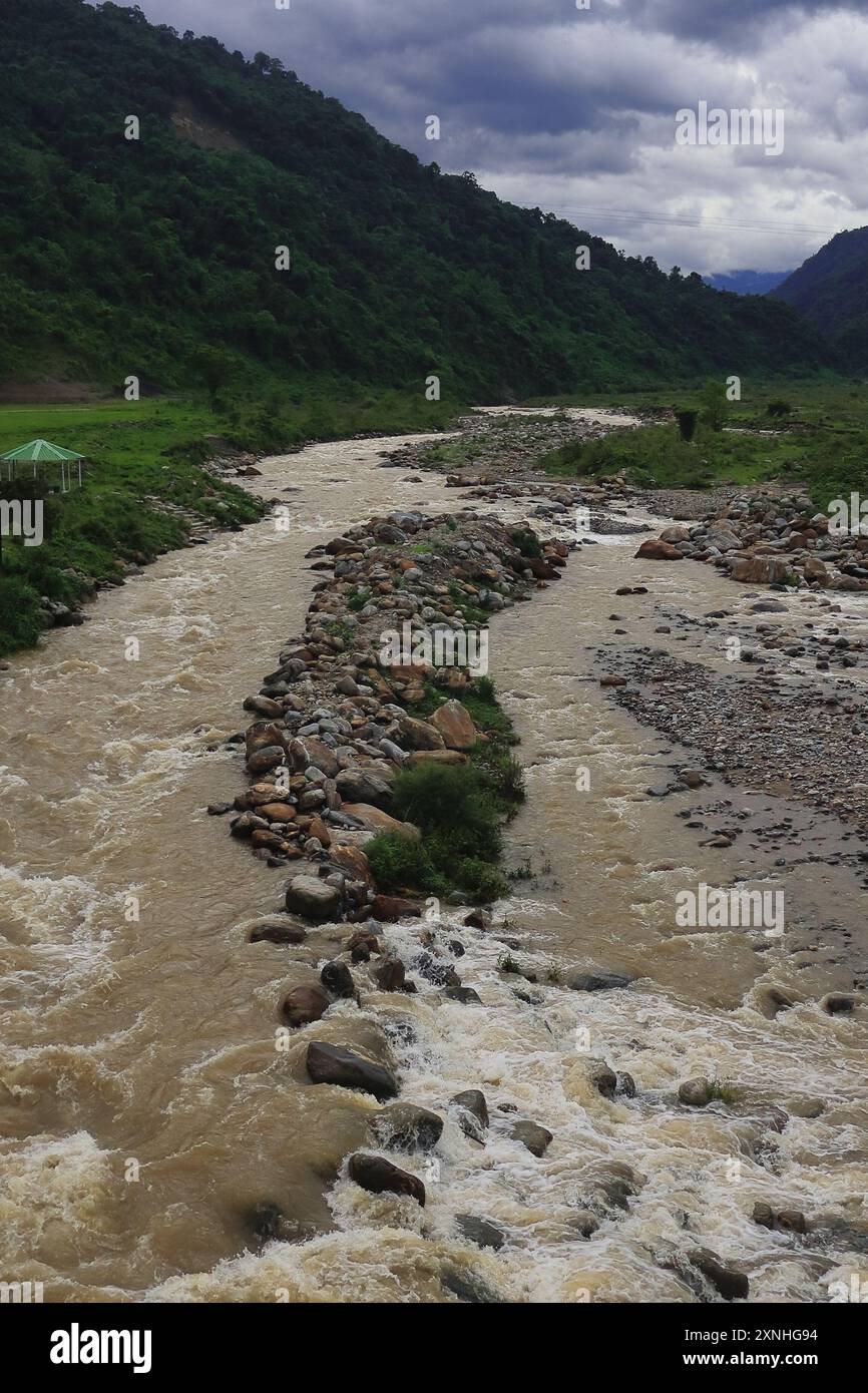 mountain river balason, flowing through the lush green valley of terai ...