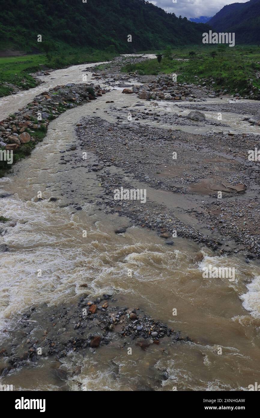 mountain river balason, flowing through the lush green valley of terai ...