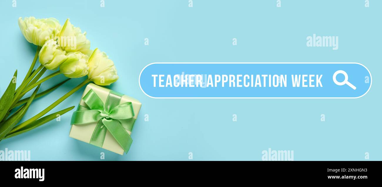 Gift box and beautiful tulip flowers on light blue background. Banner ...