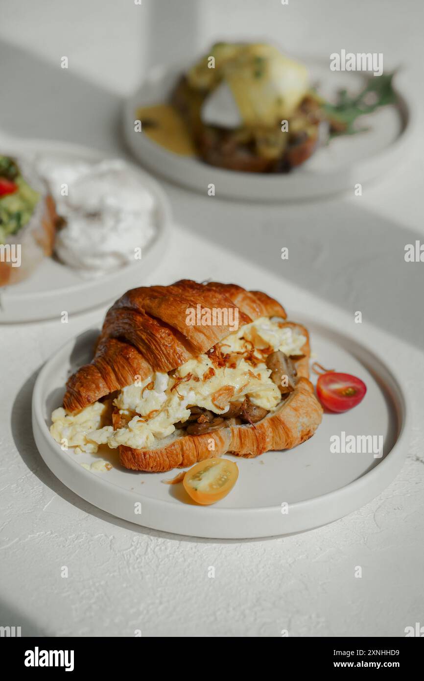 Delicious-looking breakfast croissant with crispy bacon and egg Stock ...
