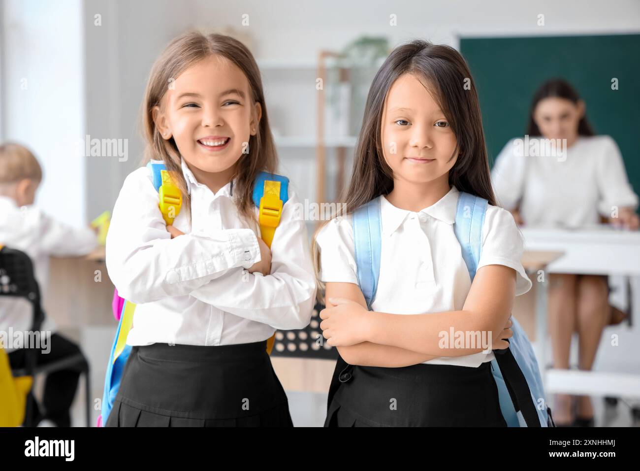 Little girls in classroom at school Stock Photo - Alamy